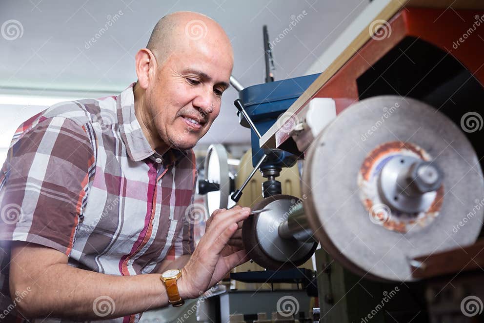 Professional Knife and Scissors Sharpening on Machine Stock Photo ...