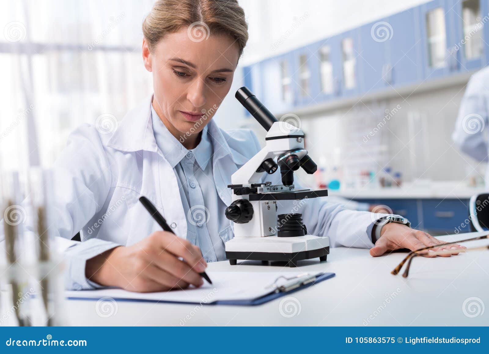 Lab Technician Taking Notes Stock Image - Image of analysis, people ...
