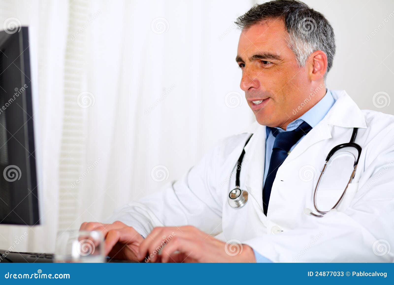Professional Latin Doctor Using a Computer Stock Image - Image of ...