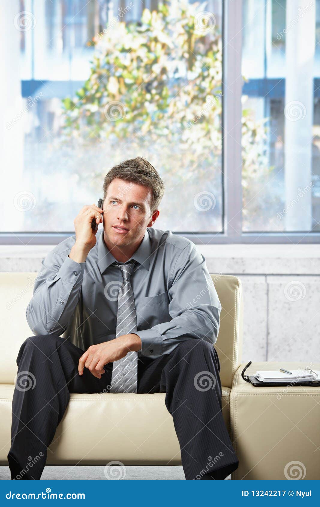 Professional Listening To Phonecall on Sofa Stock Image - Image of ...