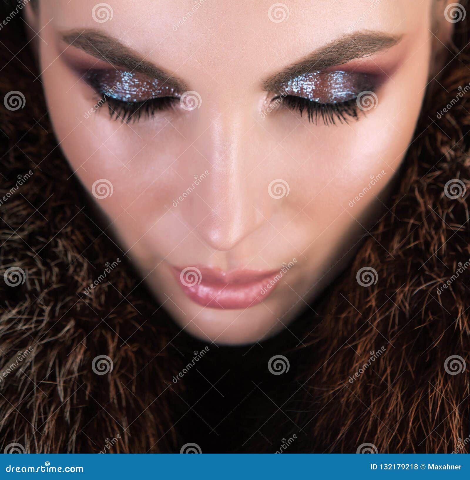 Professional Makeup Using Highlighter and Shiny Eyeshadows Stock Photo ...