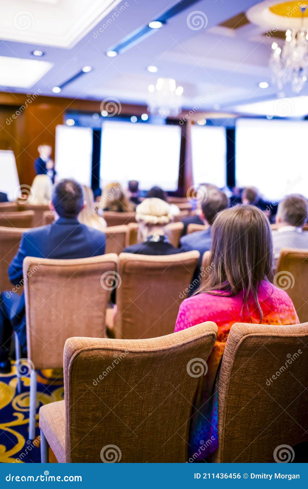 Professional Male Host Speaking in Front of the Businesspeople in the ...