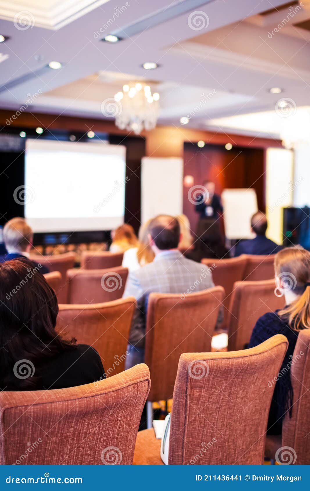 Professional Male Presenter Speaking in Front of the Group of People in ...