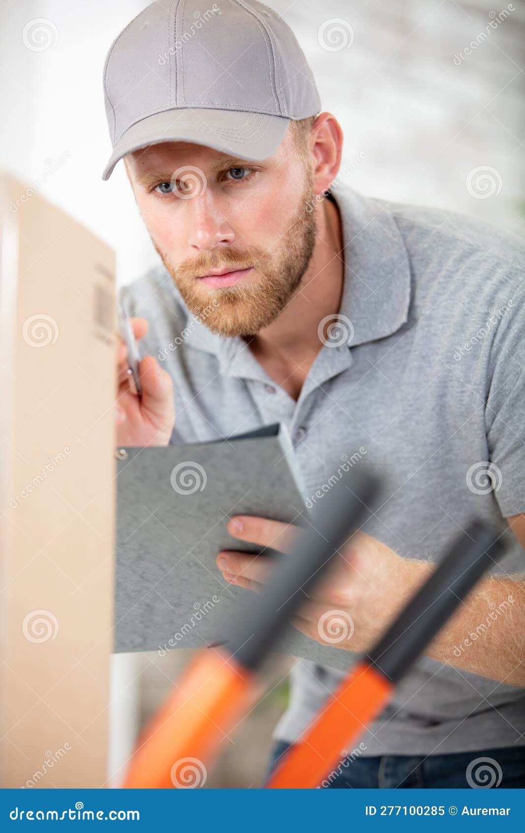 Professional Man Checking Details on Cardboard Box Stock Image - Image ...