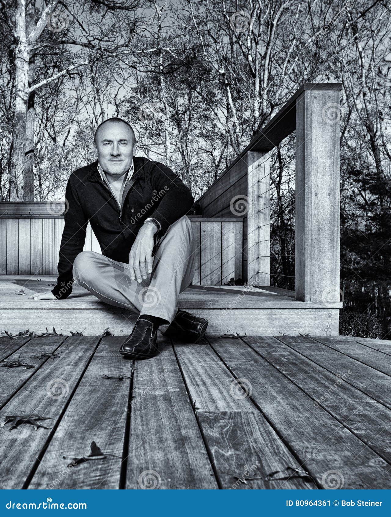 Professional Man Sat on Garden Decking Stock Image - Image of ...