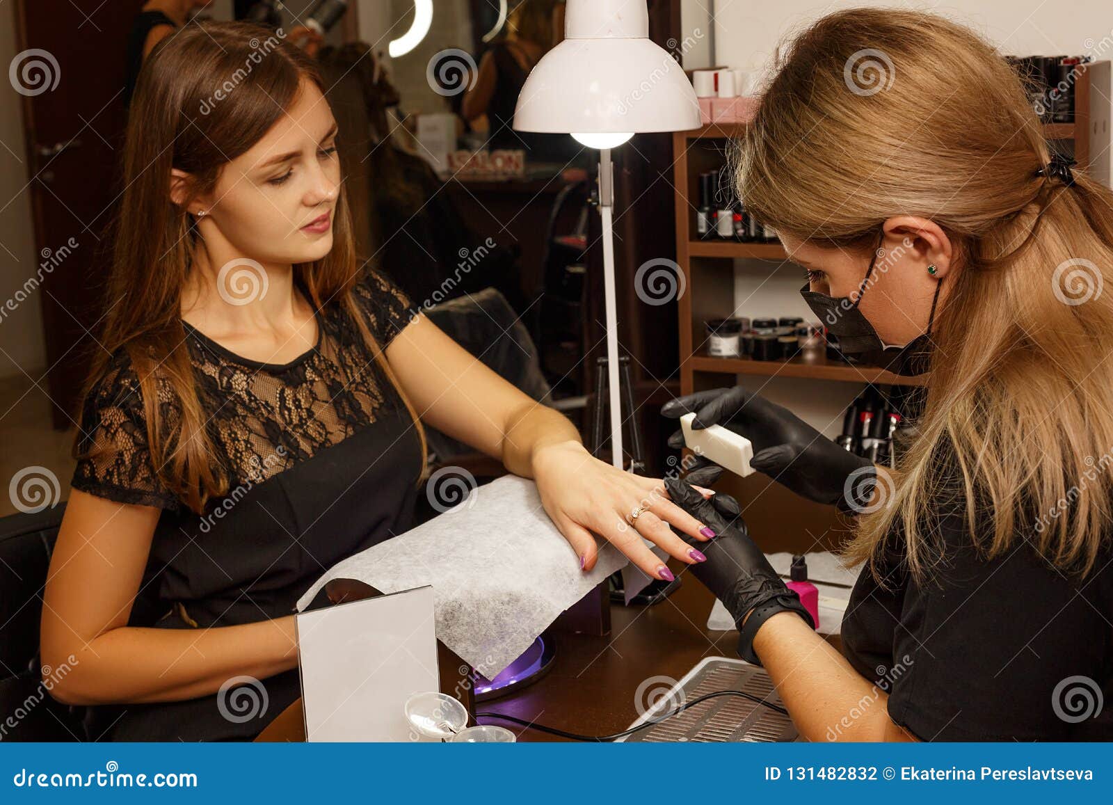 Professional Master of Manicure Makes the Nails To the Client Stock ...