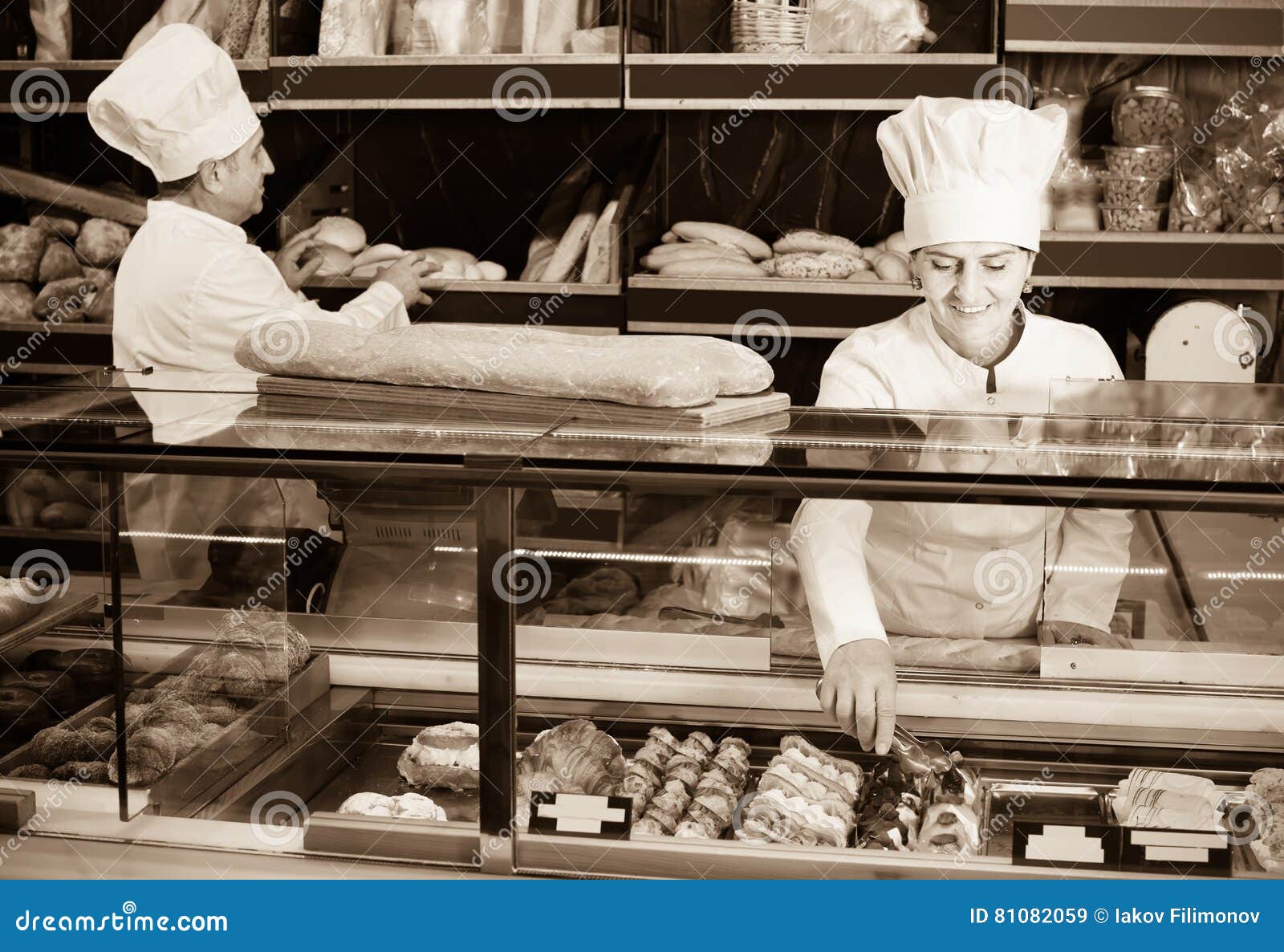Professional Mature Bakers with Fresh Bread in Bakery Stock Image ...