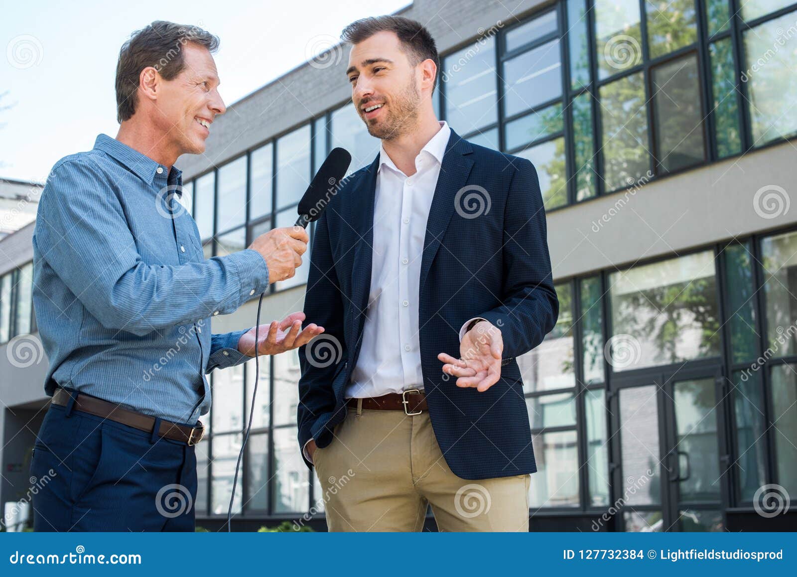 Professional Mature Journalist Interviewing Successful Businessman Stock Photo - Image of ...