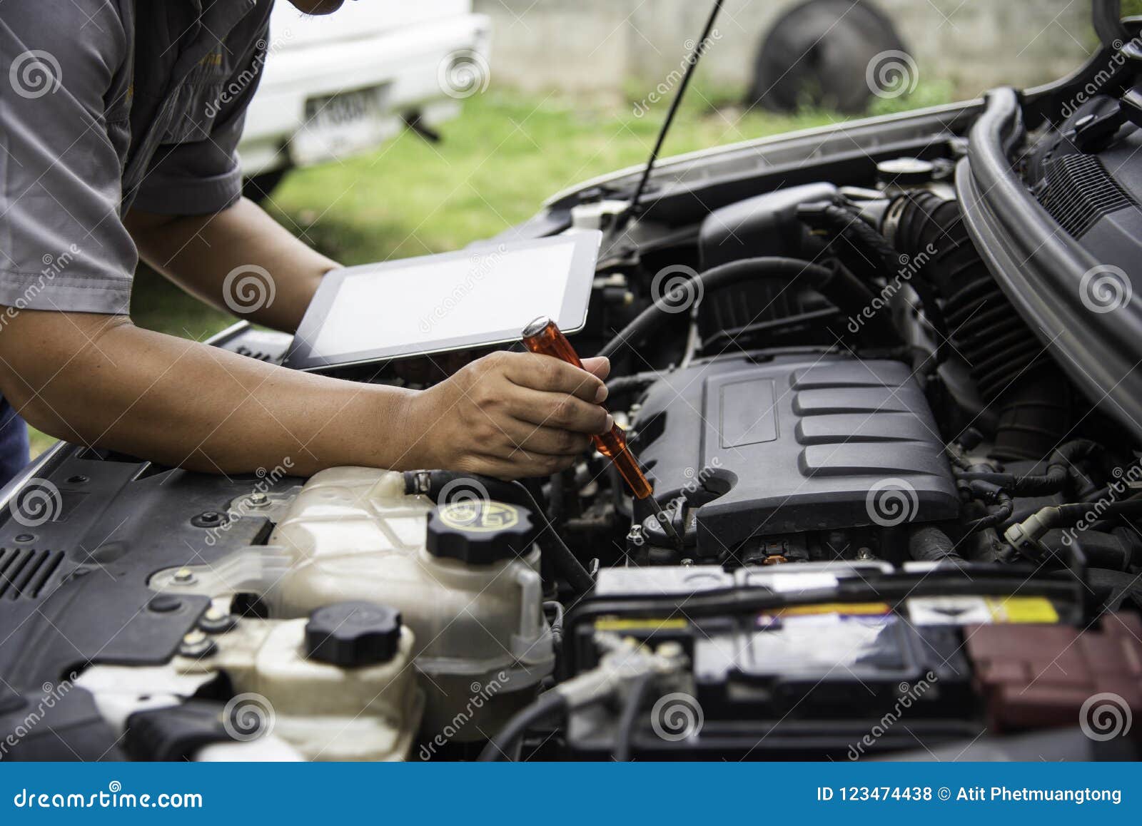 Professional Mechanic Checking Car Engine Search for Data with T Stock ...