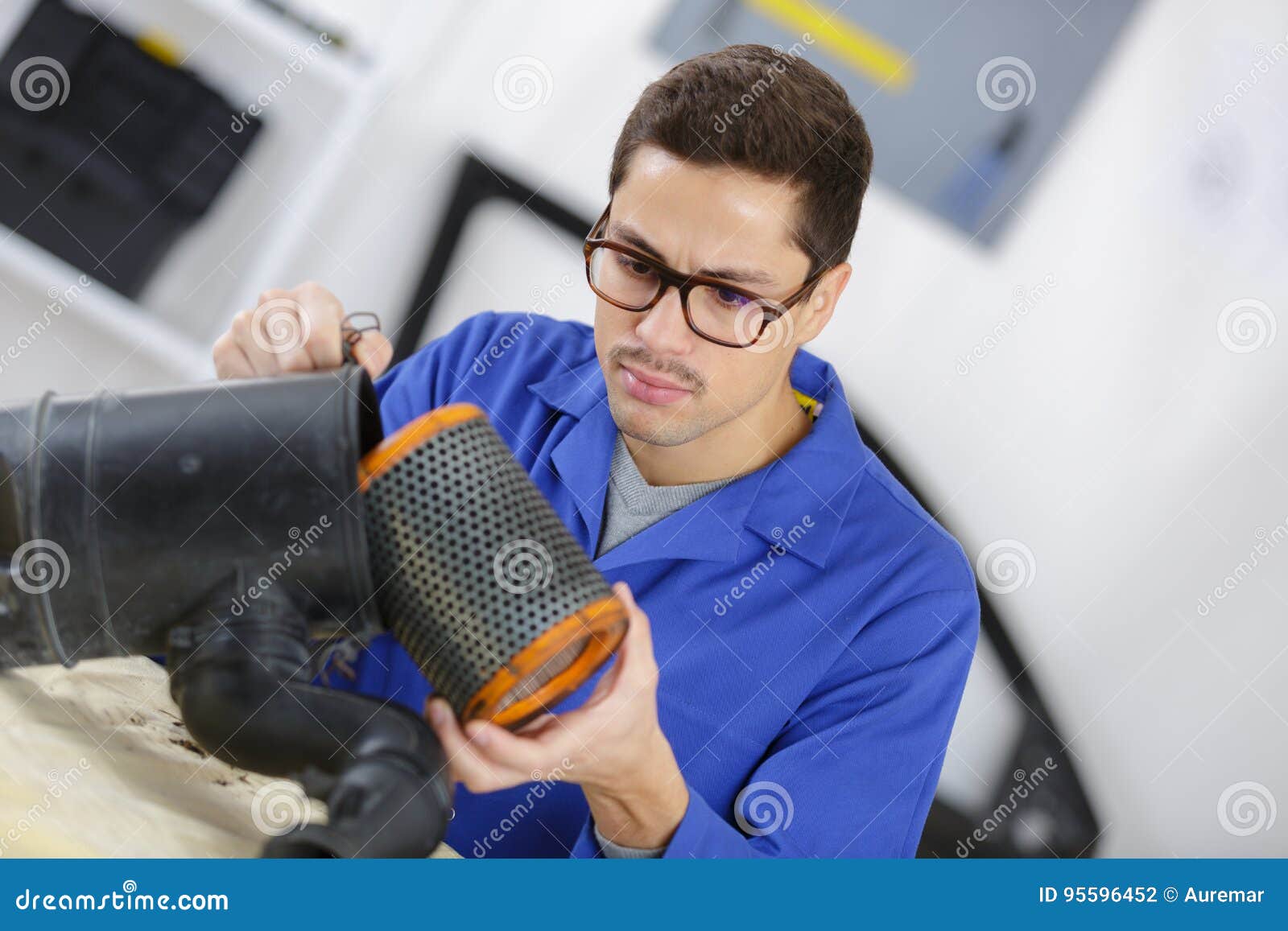 Professional Mechanic Cleaning Filter in Workshop Stock Photo - Image ...