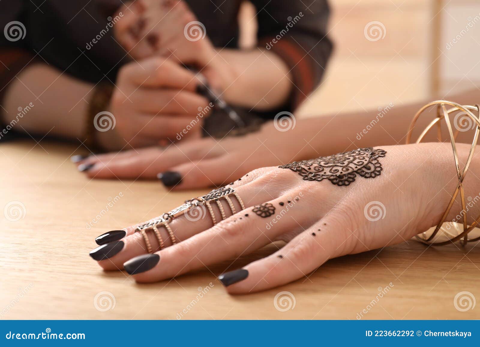 Professional Mehndi Master Making Henna Tattoo, Closeup Stock ...