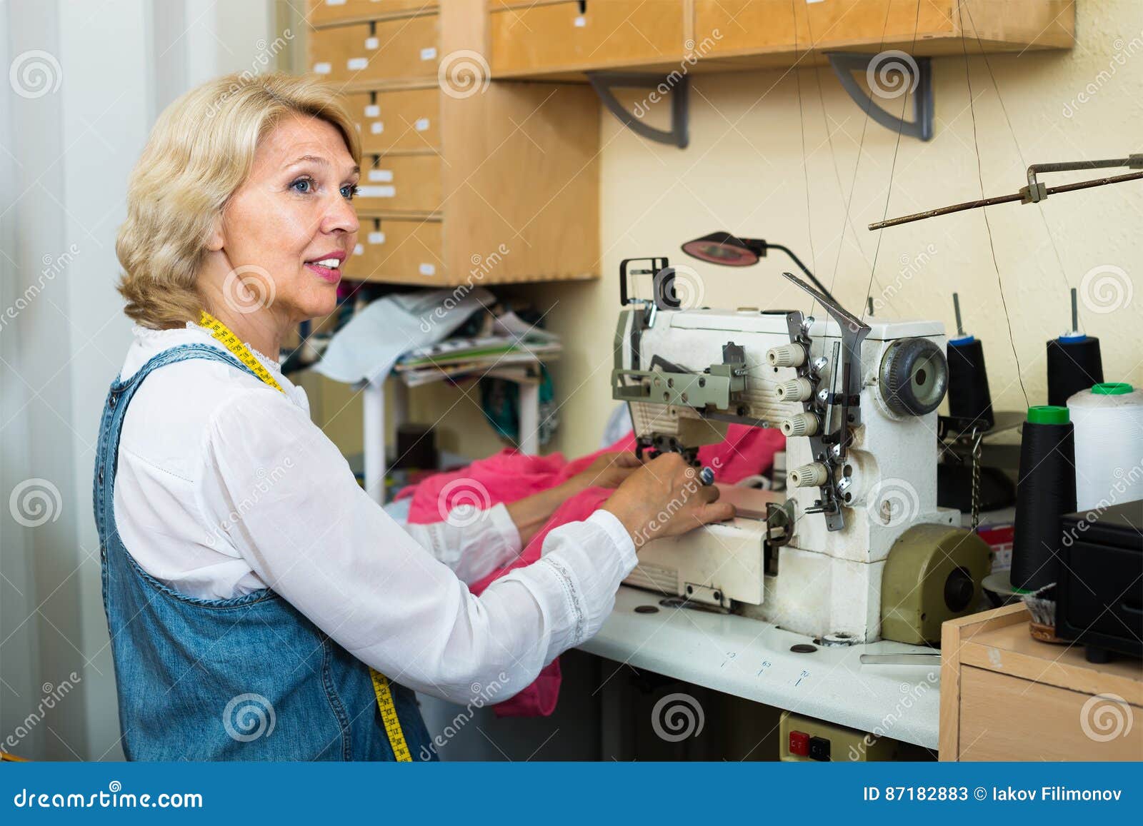 Professional Middle-aged Woman Tailor Using Sewing Machine Stock Image ...
