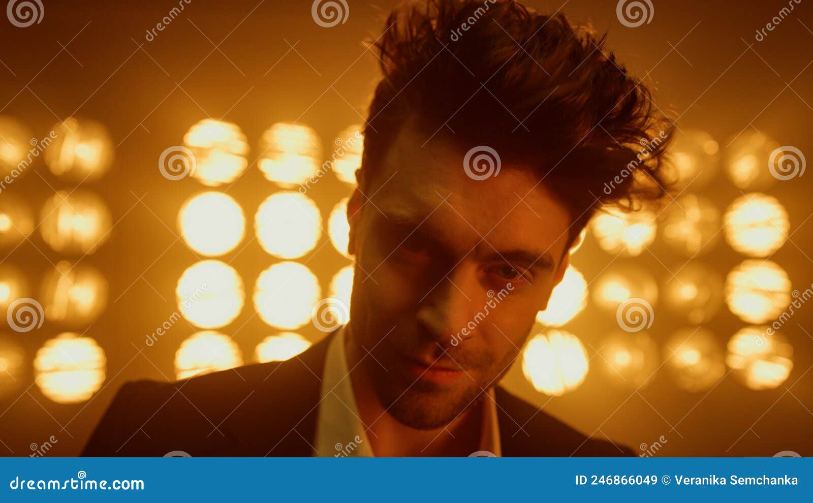 Professional Model Posing Camera in Studio with Club Spotlights. Stock ...