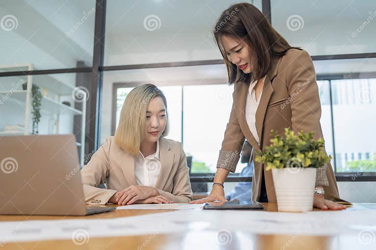 Professional Office Workers Discussing on Documents Together Stock ...