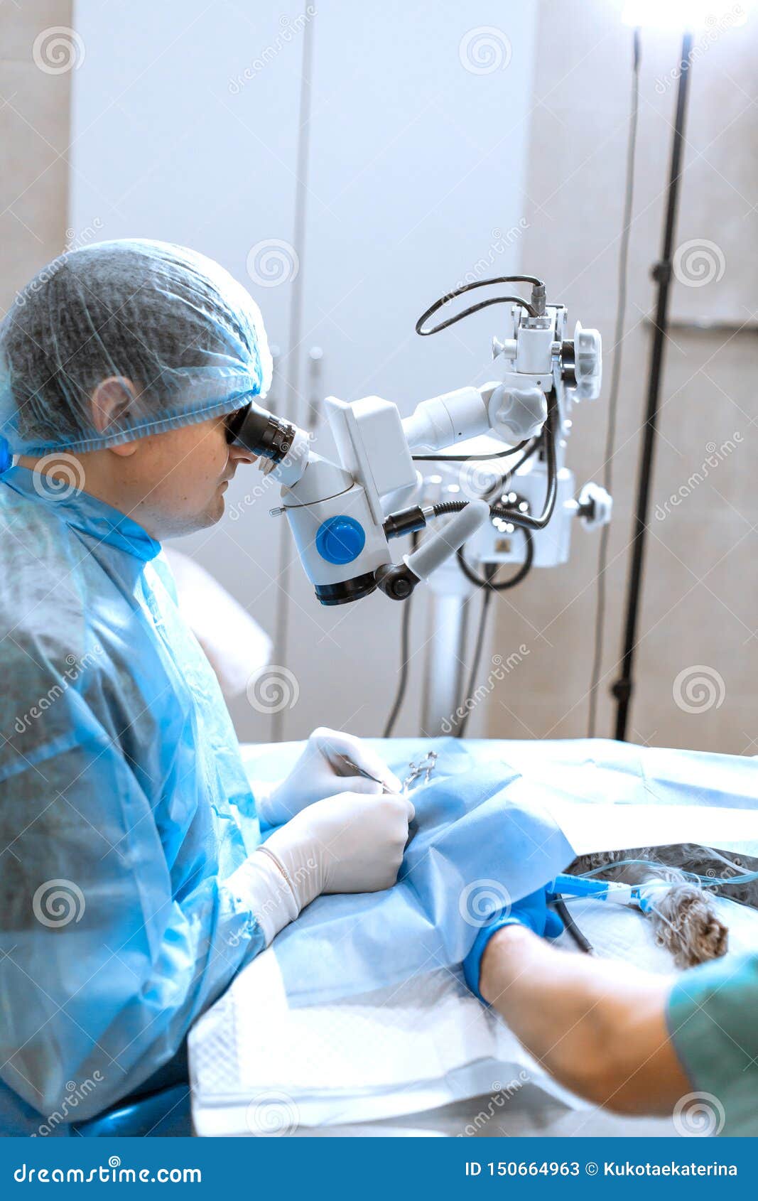 A Professional Ophthalmologist Performs Eye Surgery with a Microscope ...