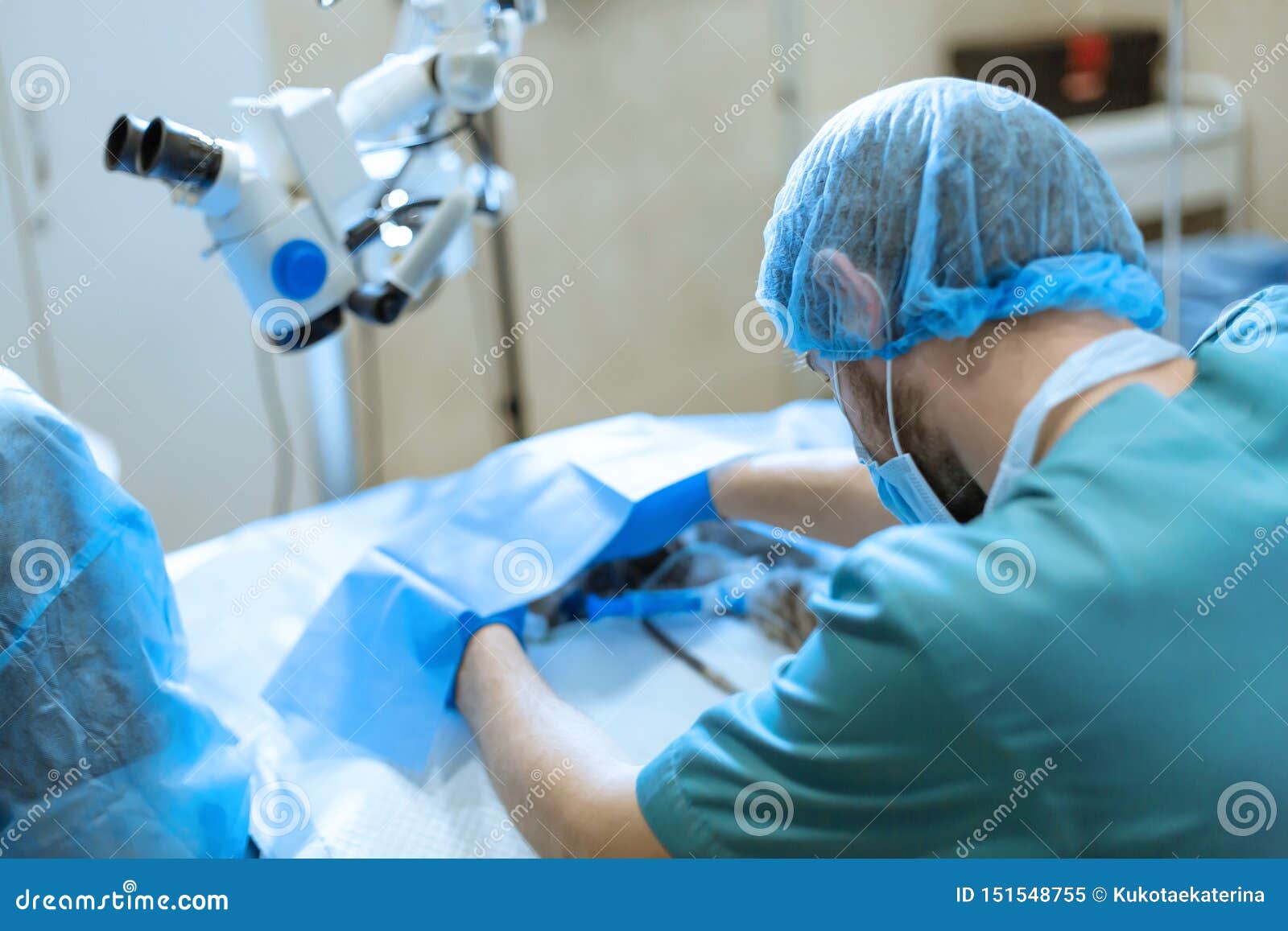 A Professional Ophthalmologist Performs Eye Surgery with a Microscope ...