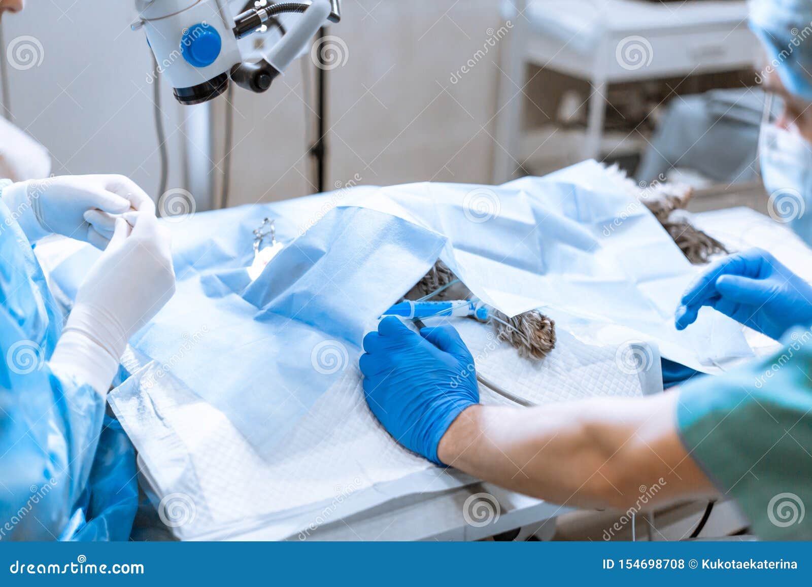 A Professional Ophthalmologist Performs Eye Surgery with a Microscope ...