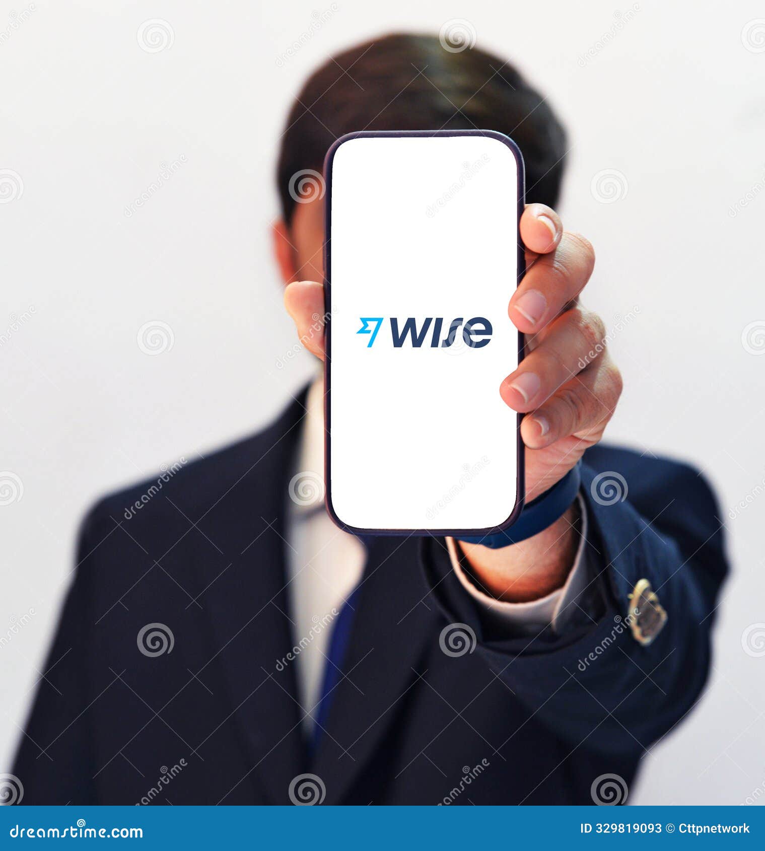 Professional Overview of Wise App on Mobile Screen by a Man in Suit ...