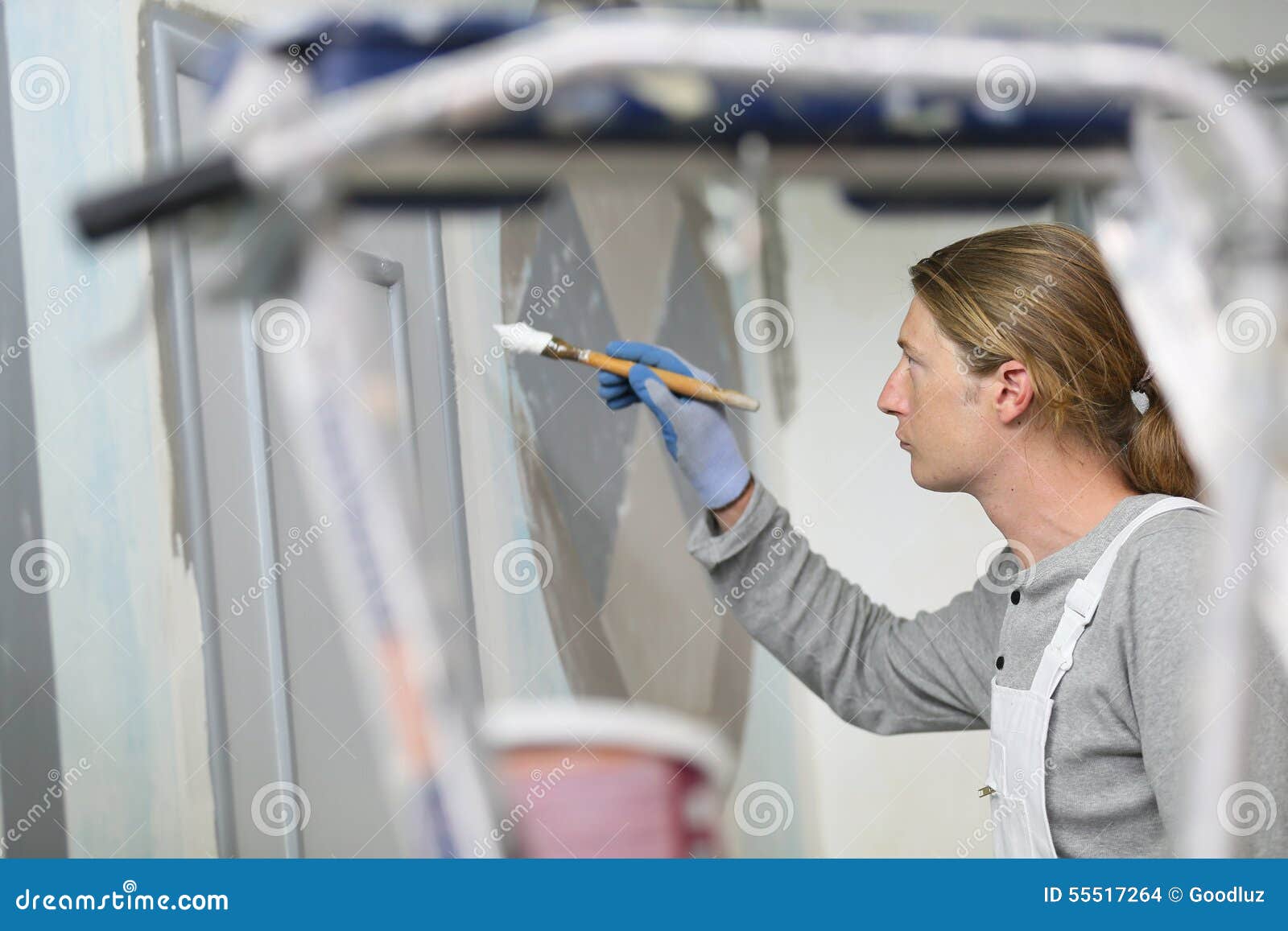 Professional Painter Painting Wall Stock Photo - Image of sitting ...