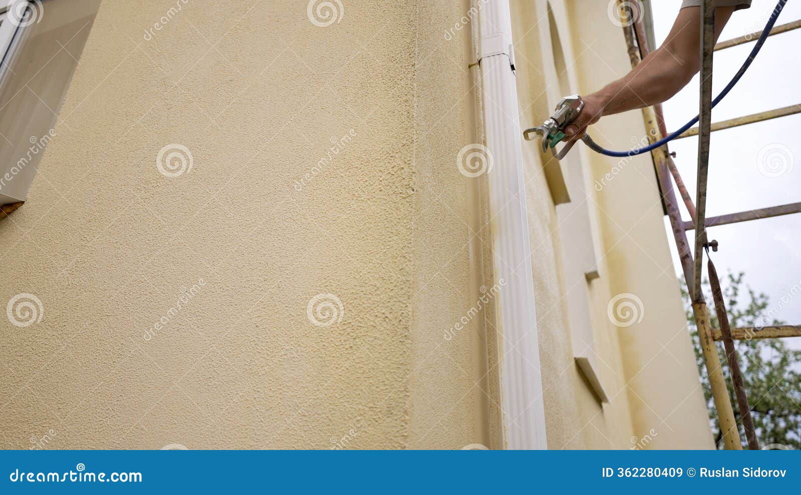 Painting Building Facade with Spray Gun Stock Image - Image of facade ...