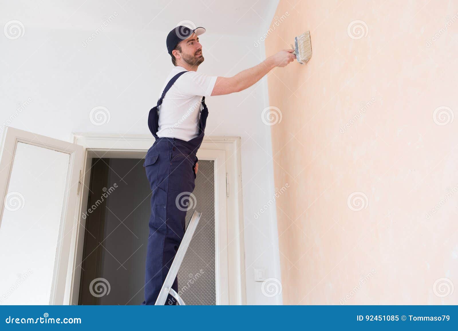 Professional Painter Worker is Painting One Wall Stock Image - Image of ...