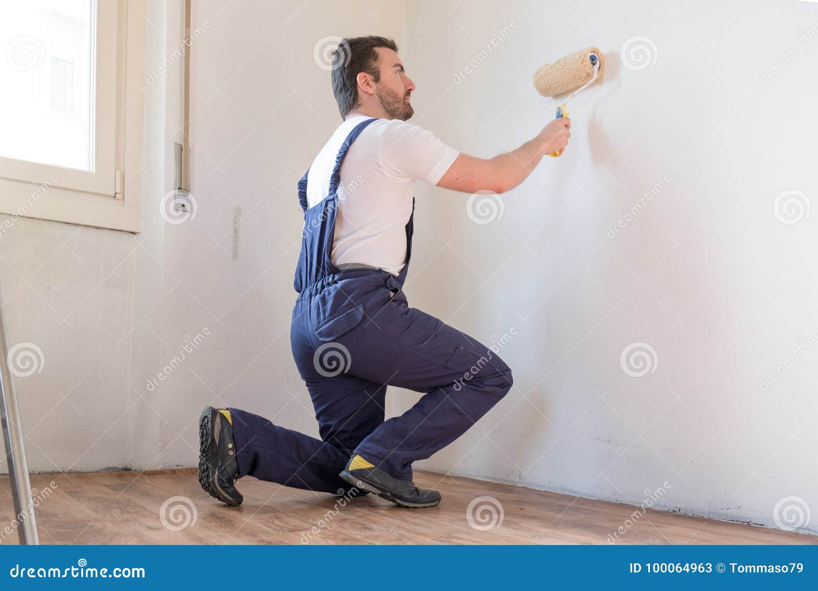 Professional Painter Worker is Painting One Wall Stock Image - Image of ...