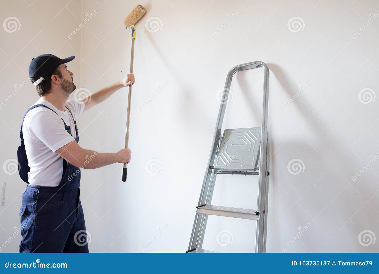 Professional Painter Worker is Painting One Wall Stock Image - Image of ...