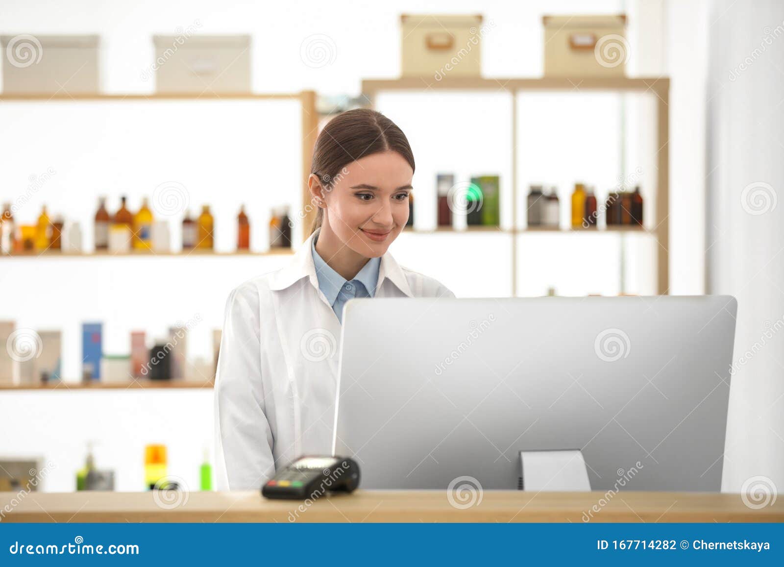 Pharmacist Working with Computer in Drugstore Stock Photo - Image of ...