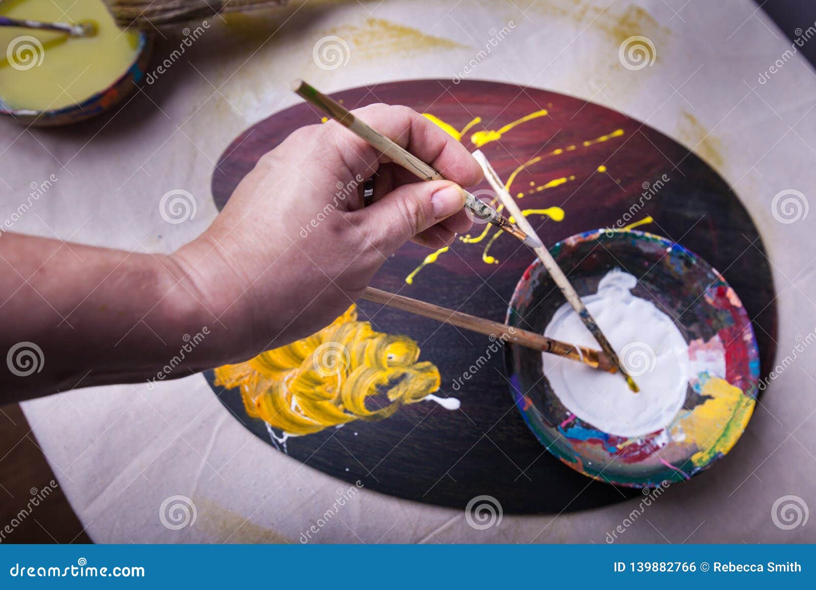 Artists Hand Holding Paintbrush Dipping it into Wet Paint Stock Photo ...