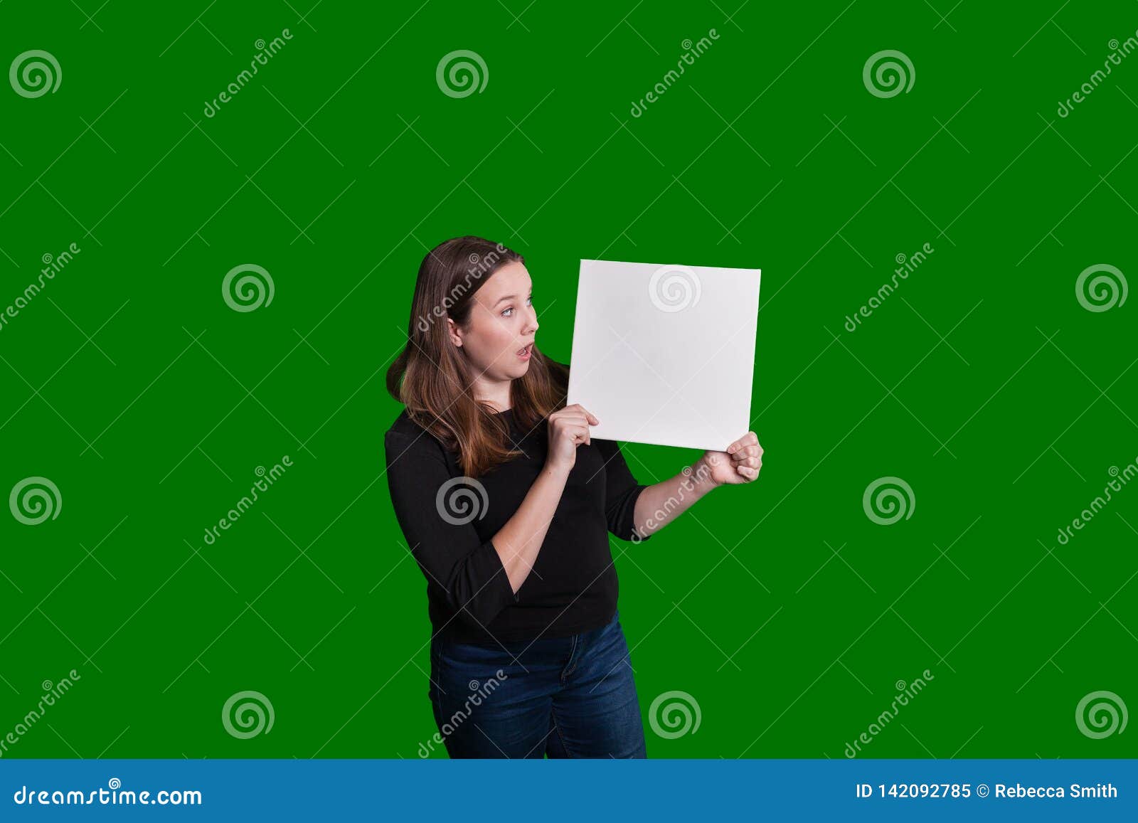 Female Holding Up Blank Sign on the Side Looking at Sign with Surprised ...