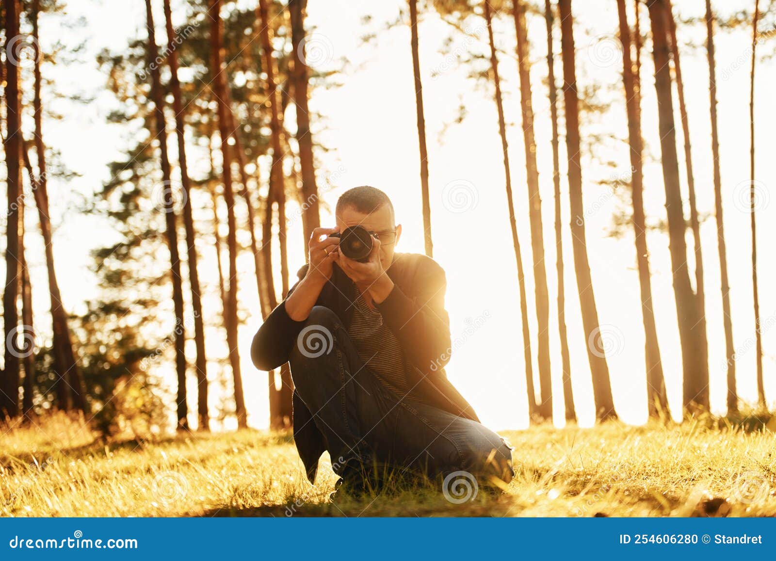 Professional Photographer with Camera Working in the Forest Stock Photo ...