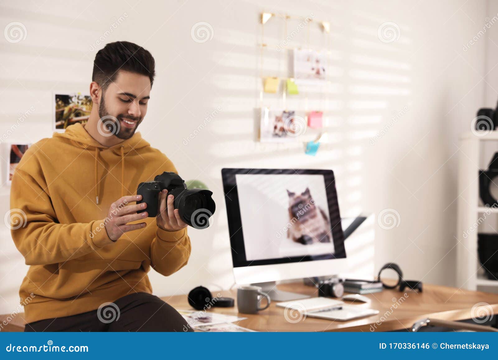 Professional Photographer with Camera Working in Modern Office Stock ...