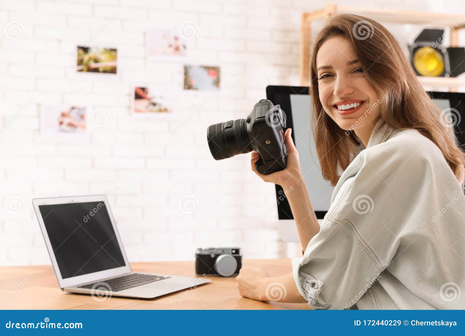 Professional Photographer with Camera Working at Table Stock Image ...