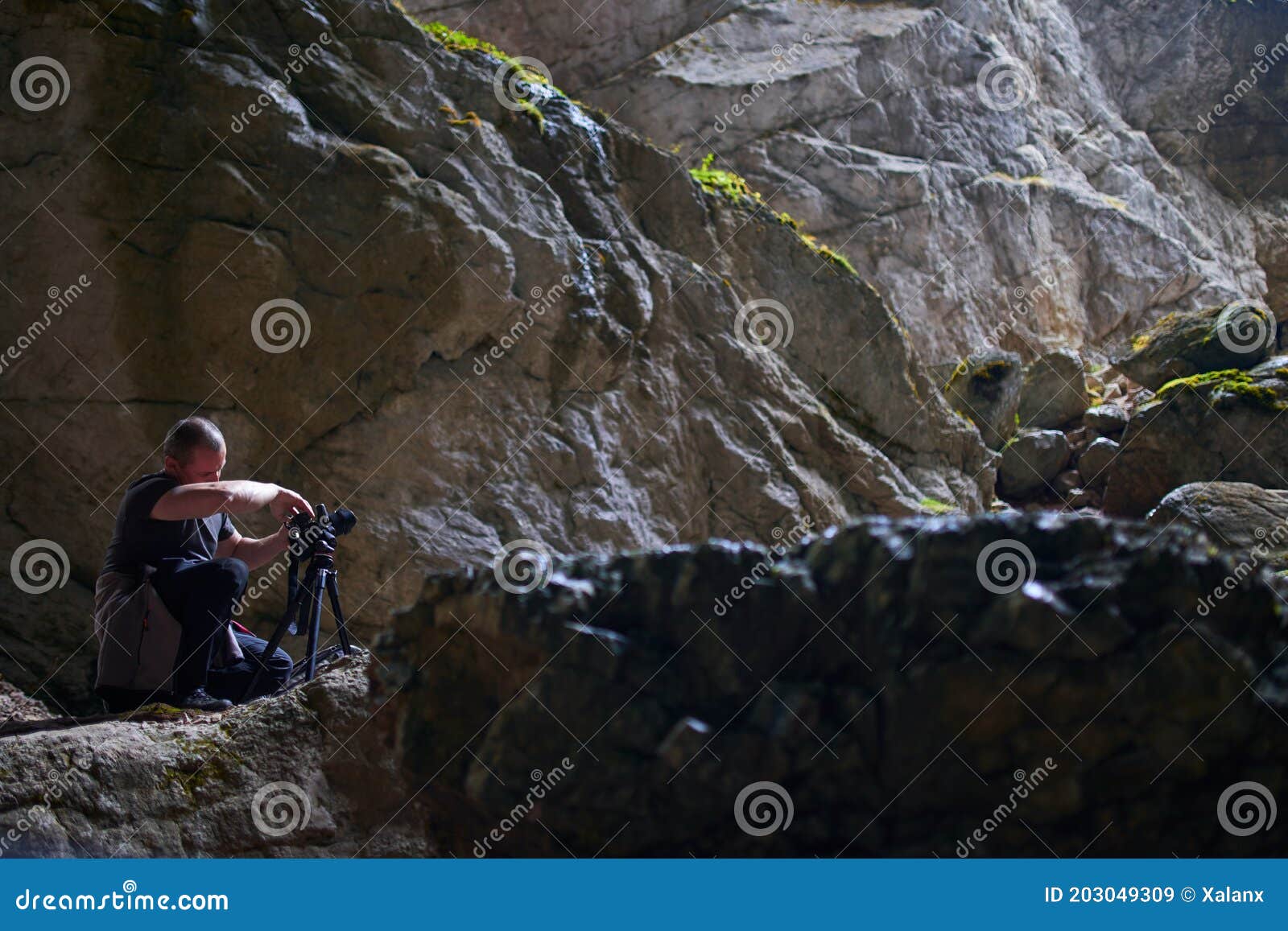 Pro Shooter Working in a Cave Stock Image - Image of leisure, outdoor ...