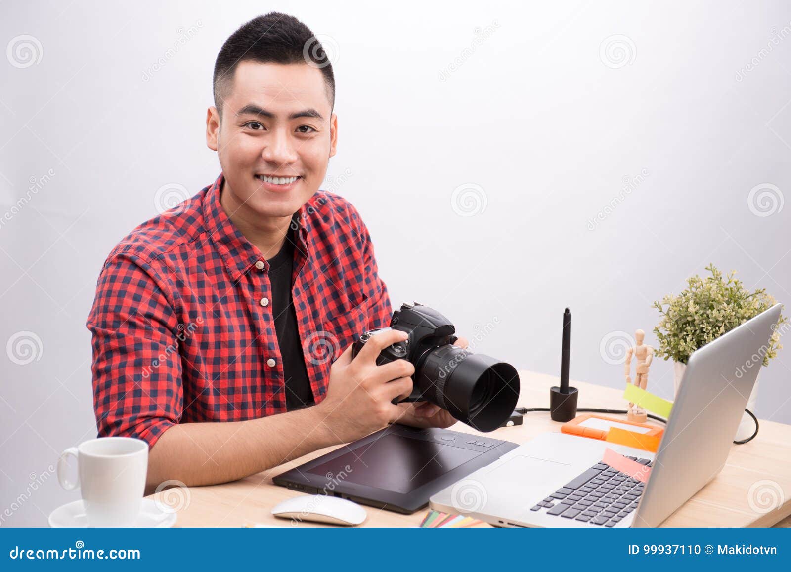 Professional Photographer. Portrait of Confident Young Man in Sh Stock ... Professional Photographer. Portrait of Confident Young Man in Sh Stock ...