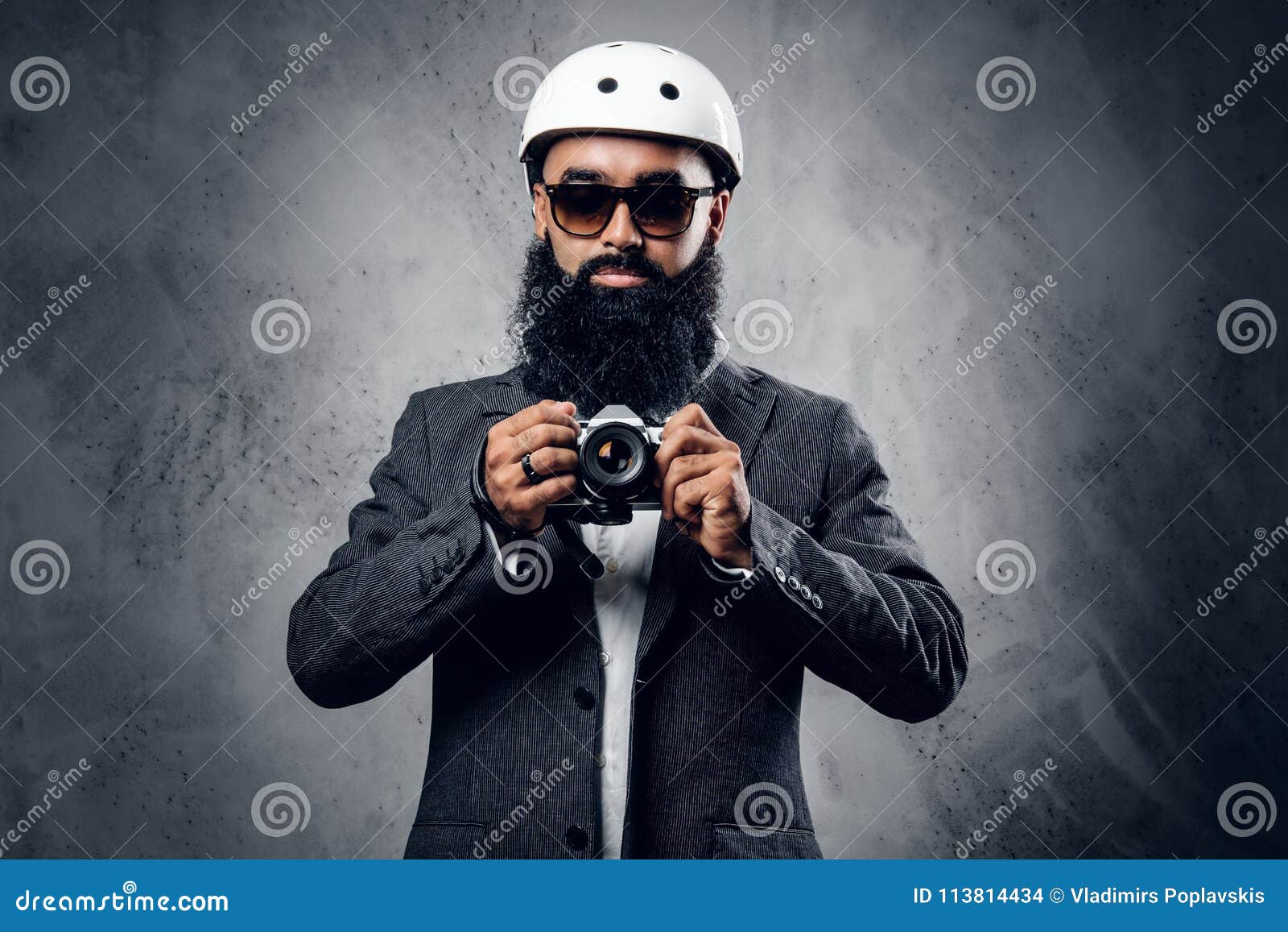 Professional Photographer in a Suit Shooting with a Compact DSLR Camera ...