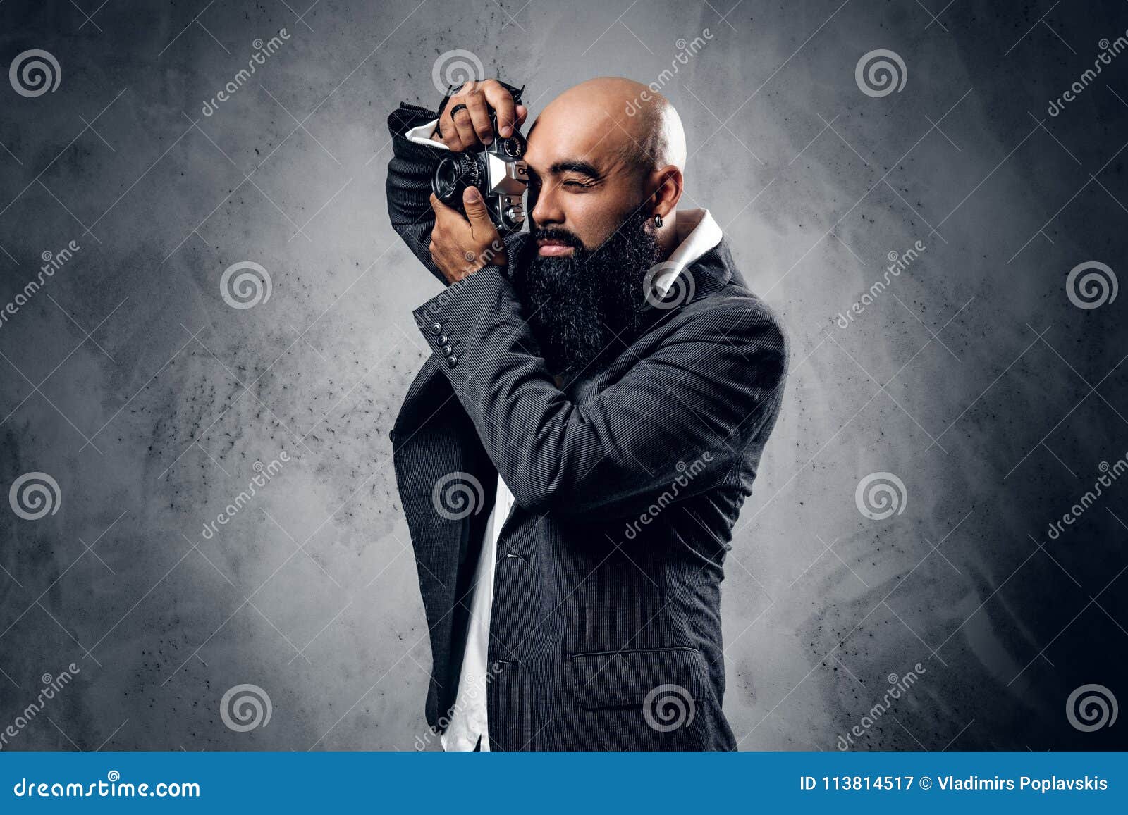 Professional Photographer in a Suit Shooting with a Compact DSLR Camera ...
