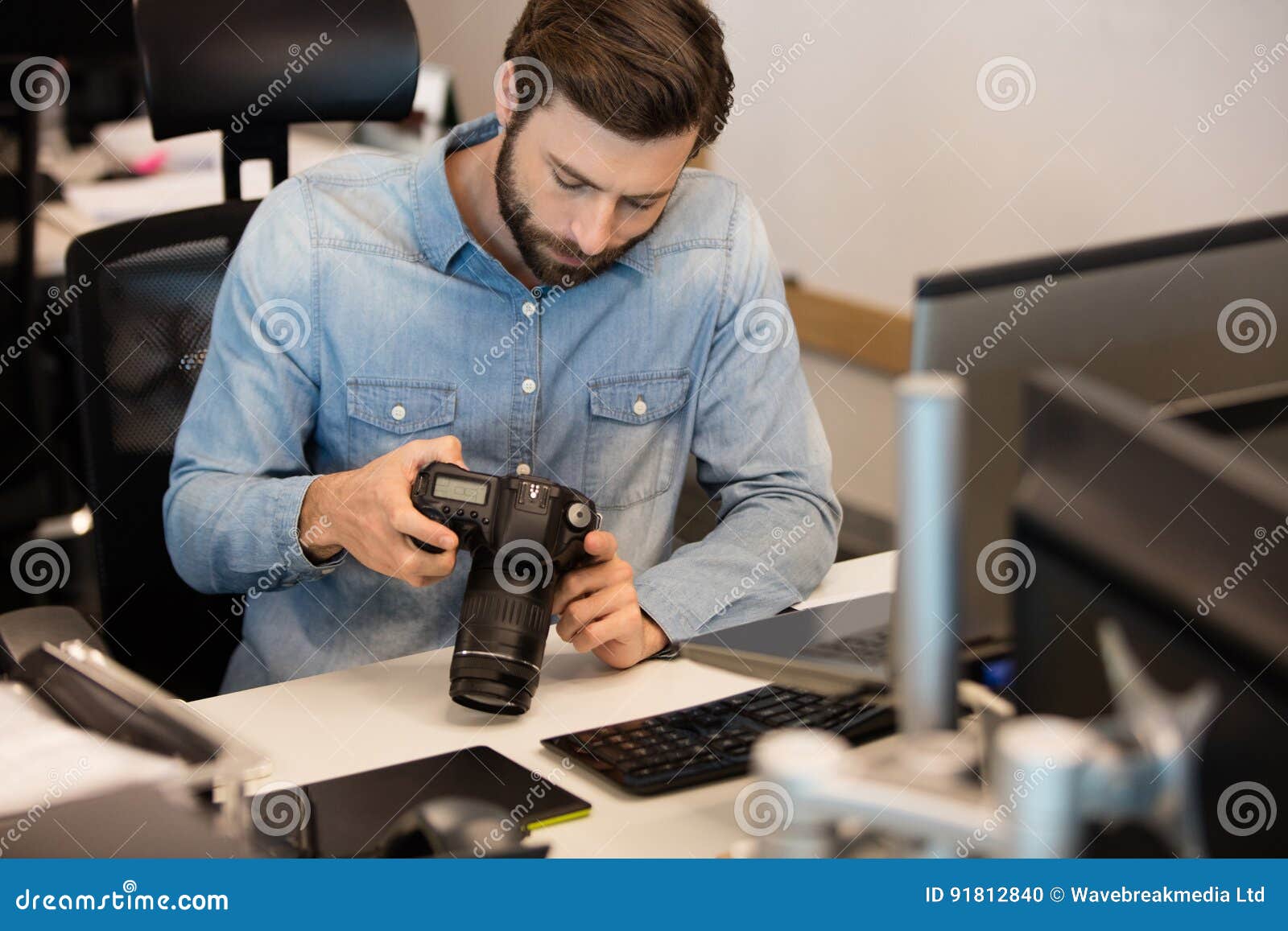 Professional Photographer Using Camera in Creative Office Stock Photo ...