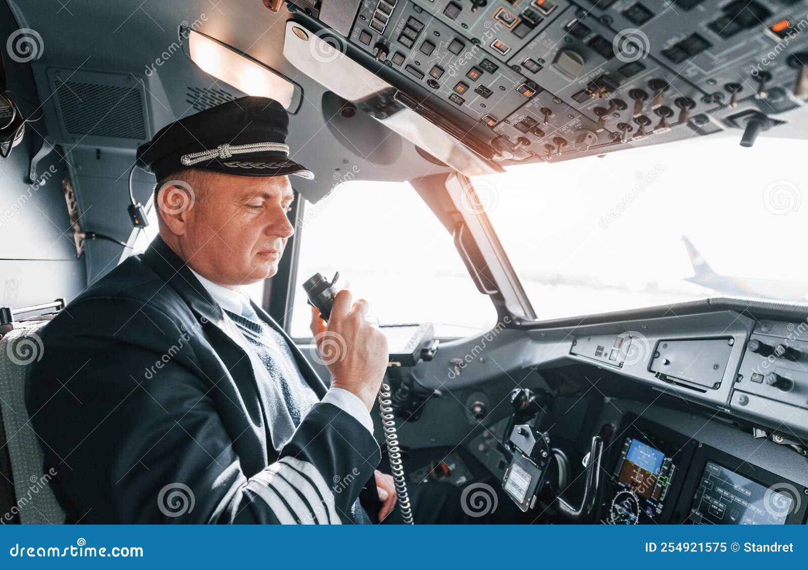 A Professional Pilot is in the Cockpit. Conception of Work Stock Image ...