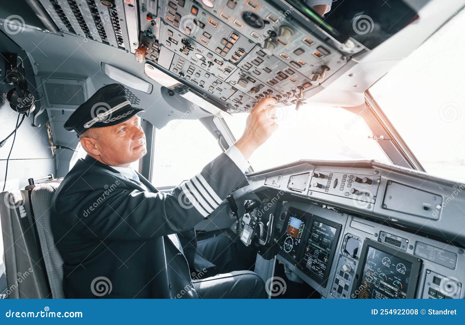 A Professional Pilot is in the Cockpit. Conception of Work Stock Photo ...