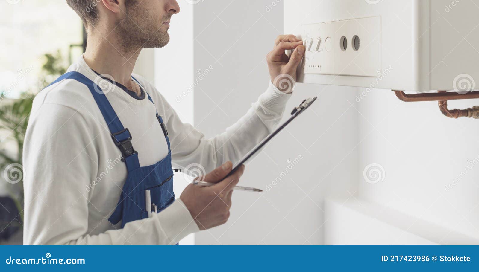 Professional Plumber Checking a Boiler Control Panel Stock Photo ...