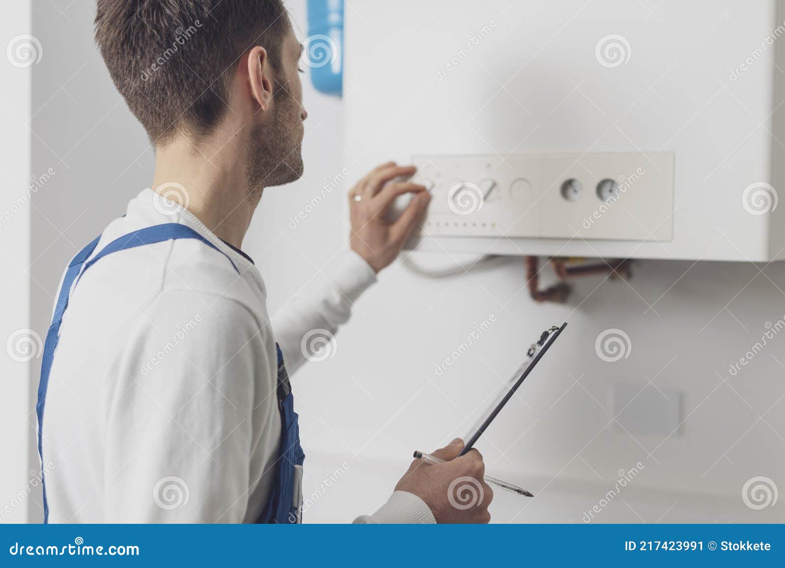 Professional Plumber Checking a Boiler Control Panel Stock Image ...