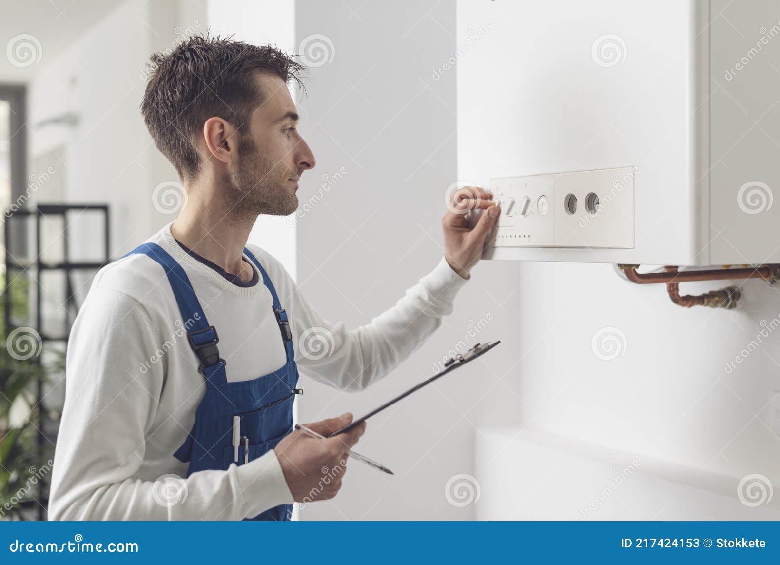 Professional Plumber Checking a Boiler Control Panel Stock Image ...