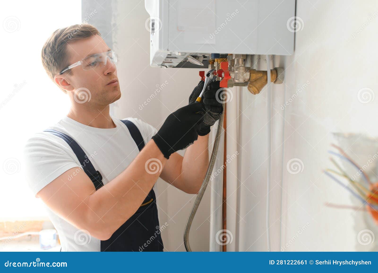Professional Plumber Checking a Boiler and Pipes, Boiler Service ...
