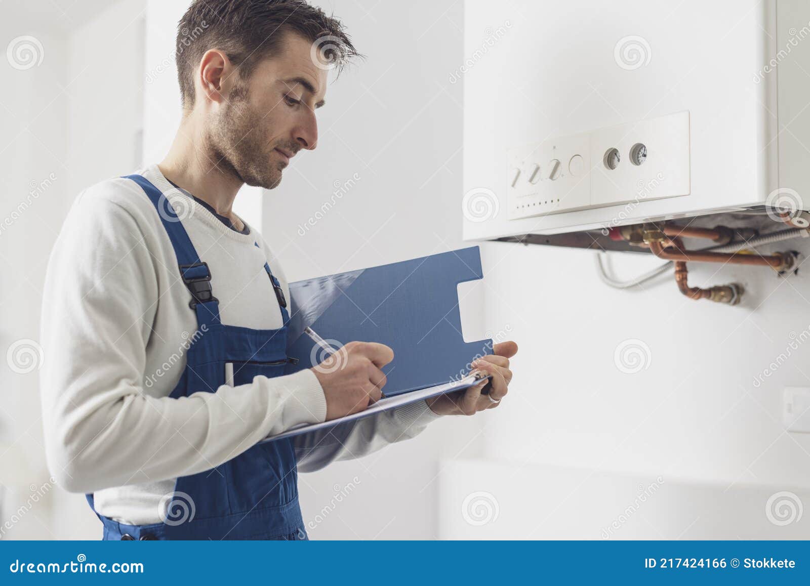 Professional Plumber Doing a Boiler Check Stock Photo - Image of ...