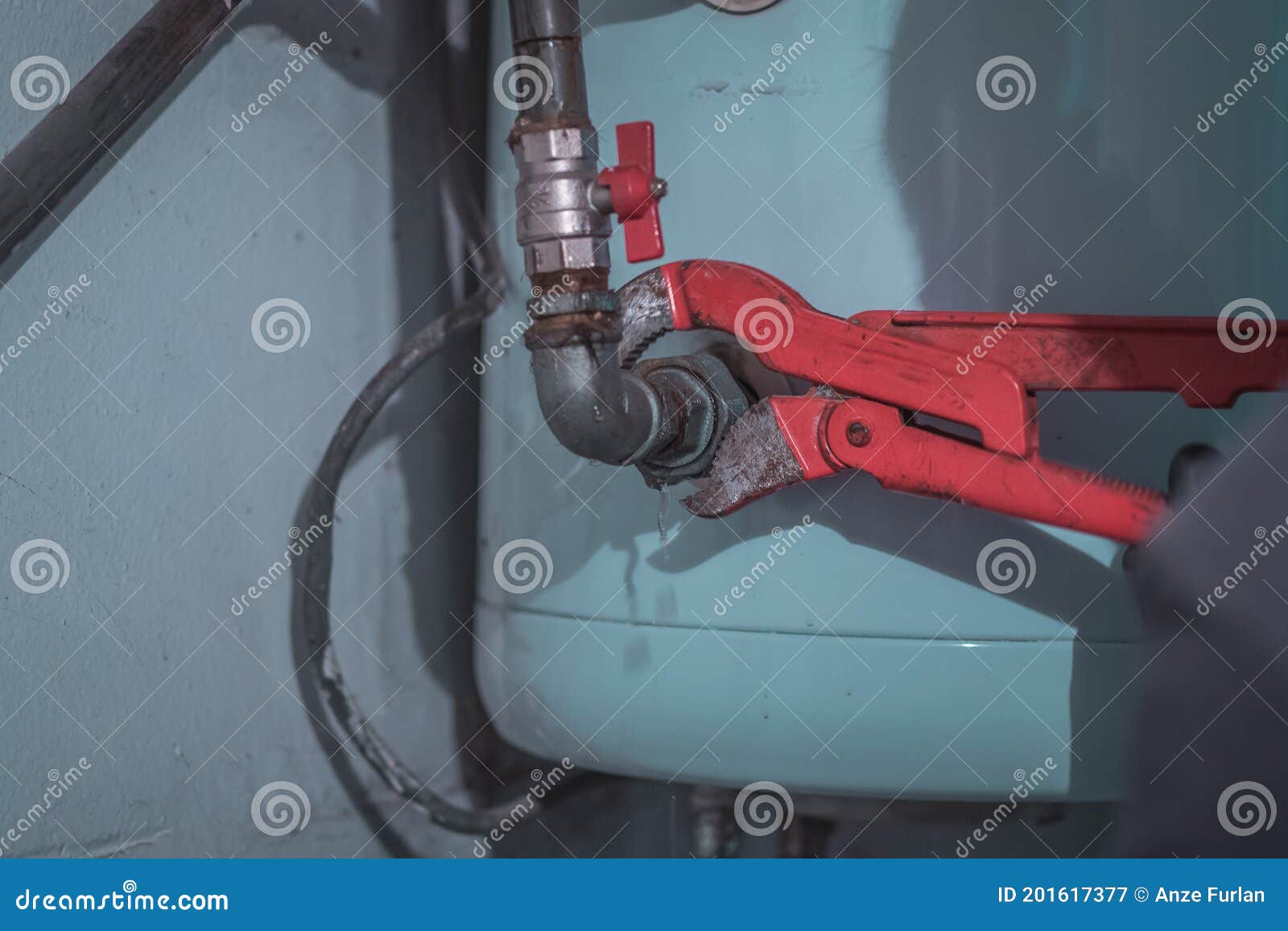 Professional Plumber Using Clamps or Spanner on a Metal Pipe Work for ...