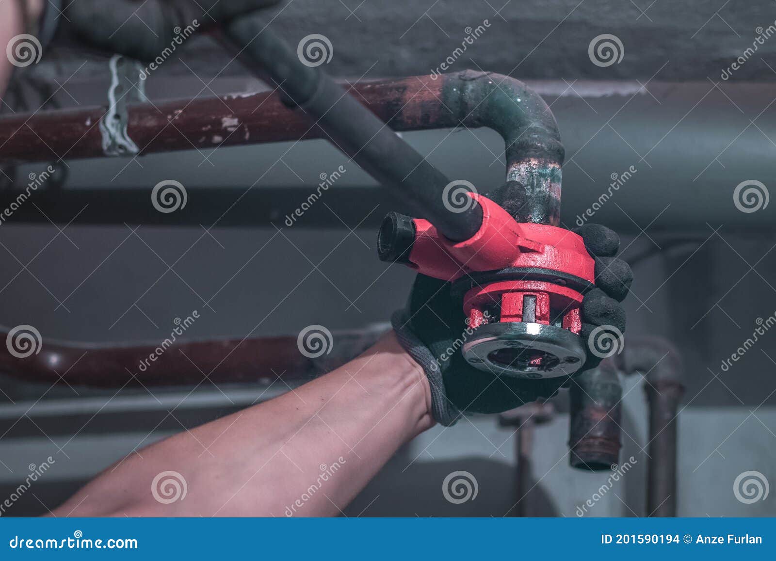 Professional Plumber Using a Tread or Thread Tool To Make Treads on a ...
