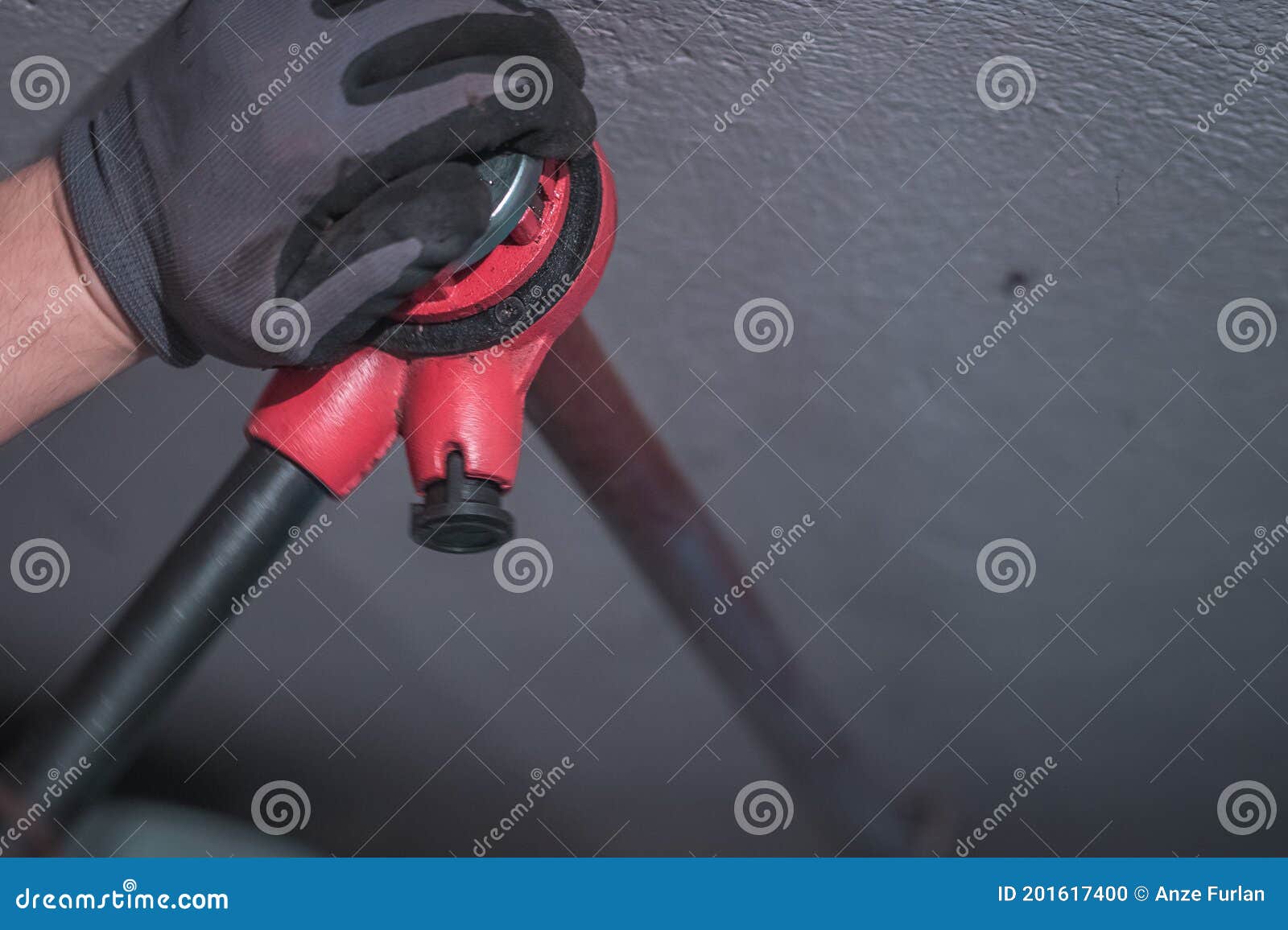 Professional Plumber Using a Tread or Thread Tool To Make Treads on a ...