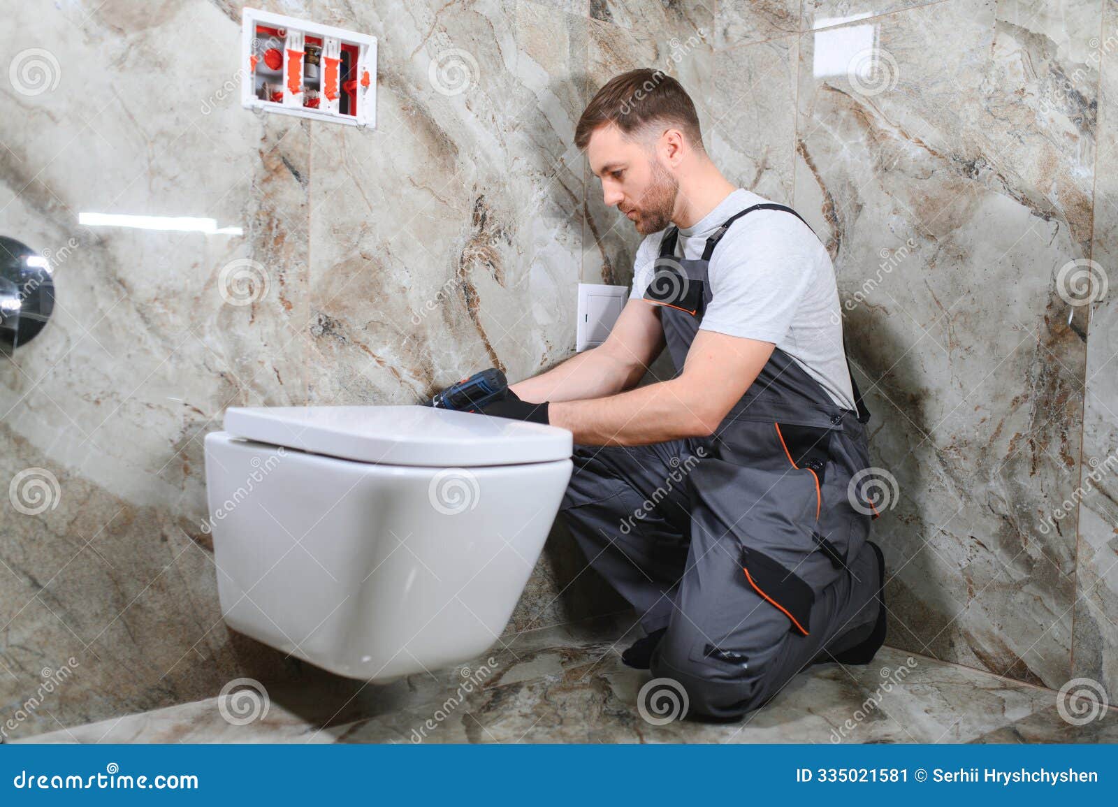 Professional Plumber Working with Toilet Bowl in Bathroom Stock Image ...