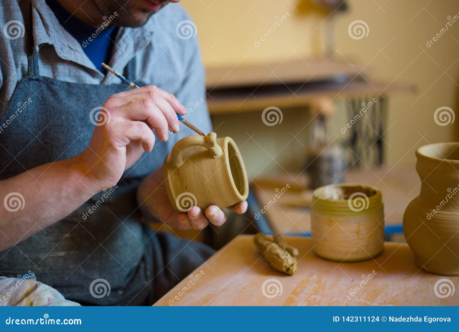 Professional Potter Making Pattern on Clay Mug with Special Tool in ...